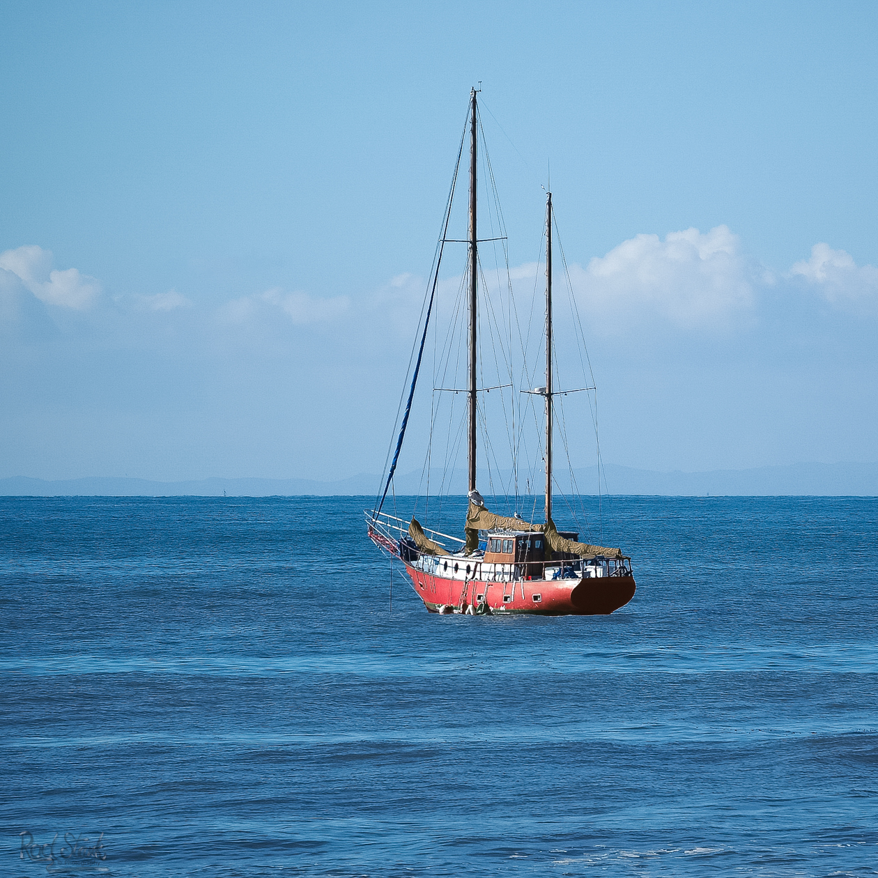 Red Boat at Sea – Rod Stark Photography